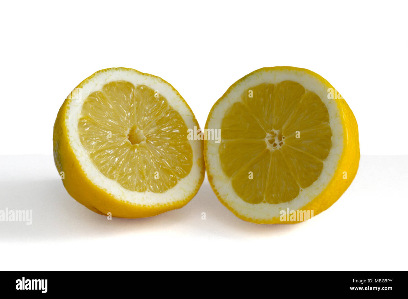 two half lemons isolated on white background Stock Photo - Alamy