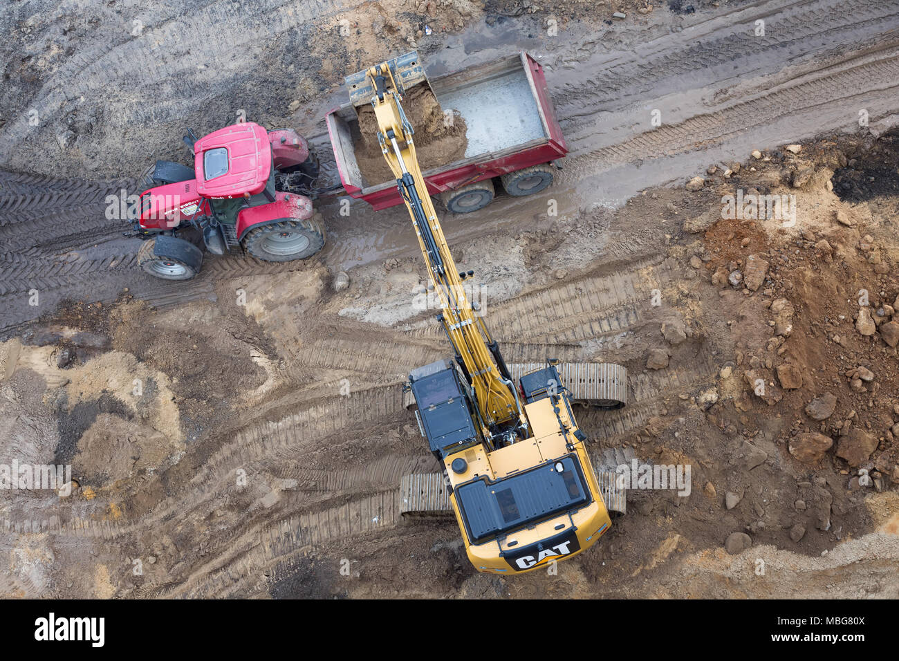 loading by digger Stock Photo - Alamy