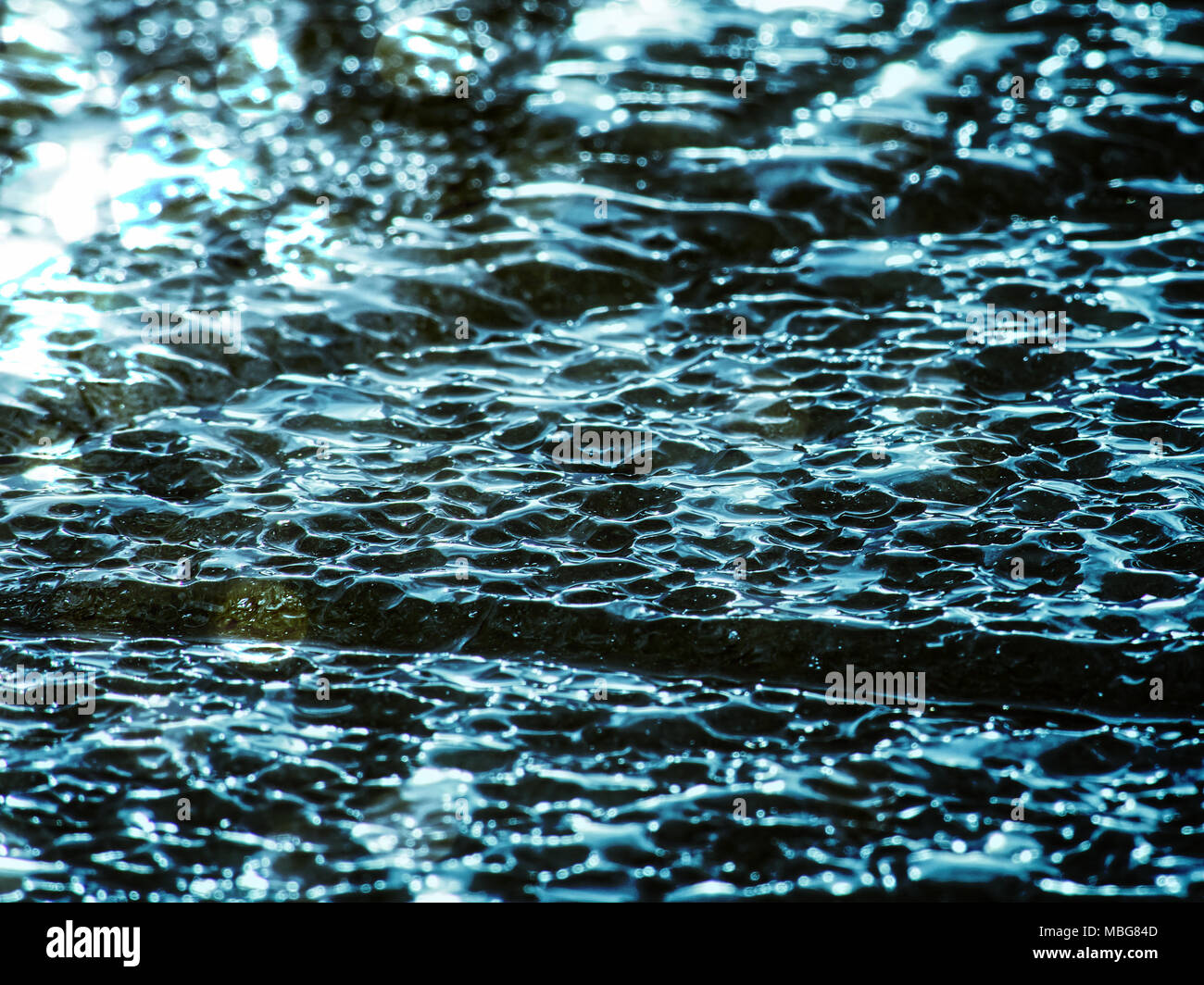Abstract effect. Detail of frozen icy sheet. Ice cracks forming surface ...