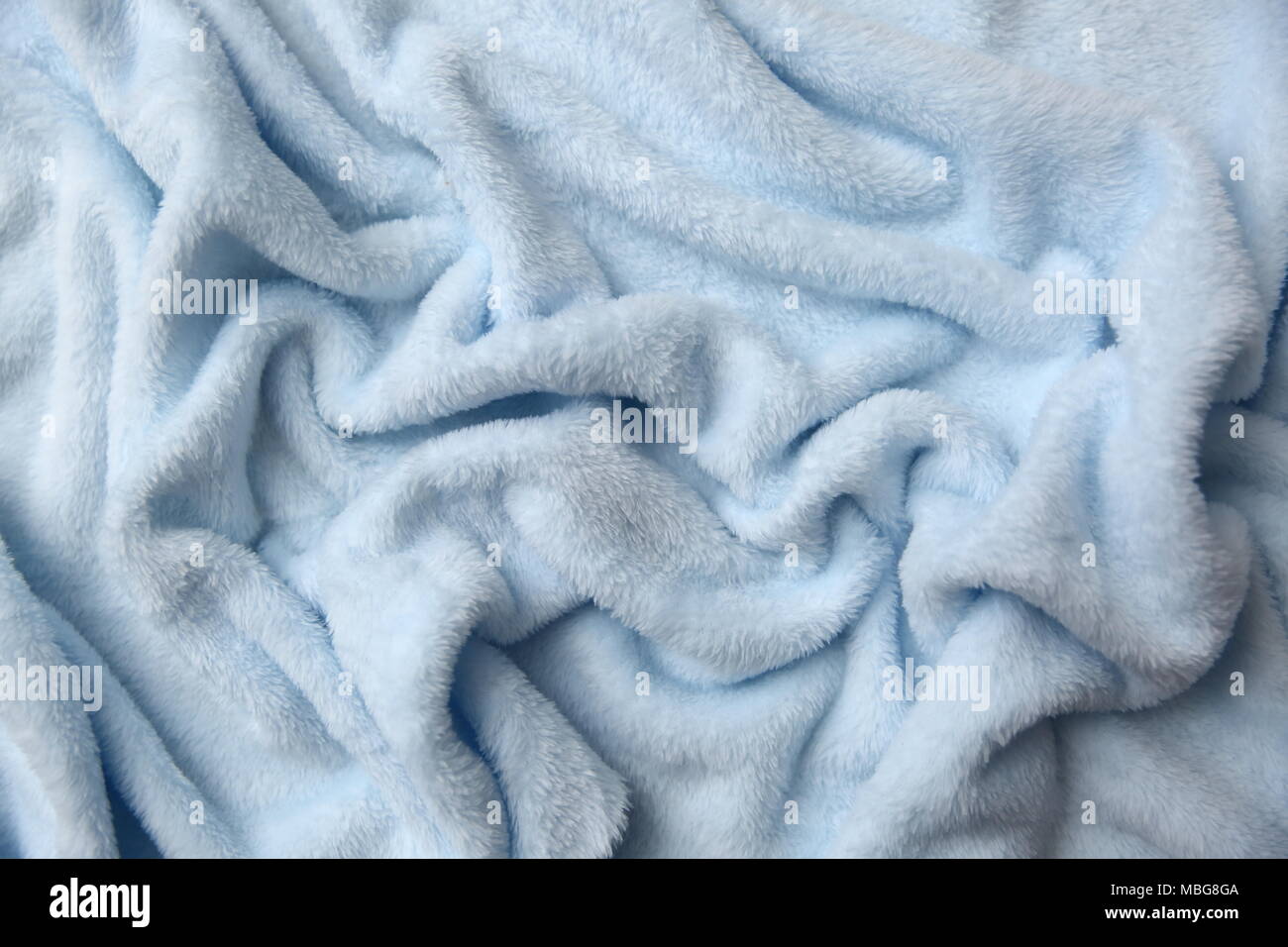 Cotton blanket with an interesting texture and crumpled irregularly in ...