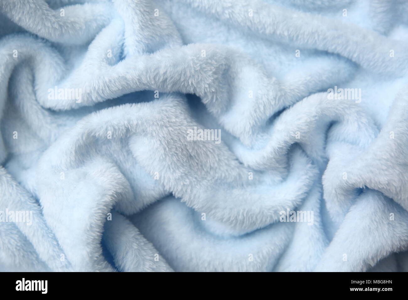 Cotton blanket with an interesting texture and crumpled irregularly in ...