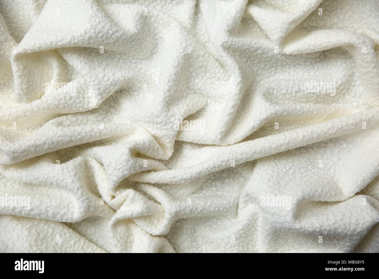 Cotton blanket with an interesting texture and crumpled irregularly in ...