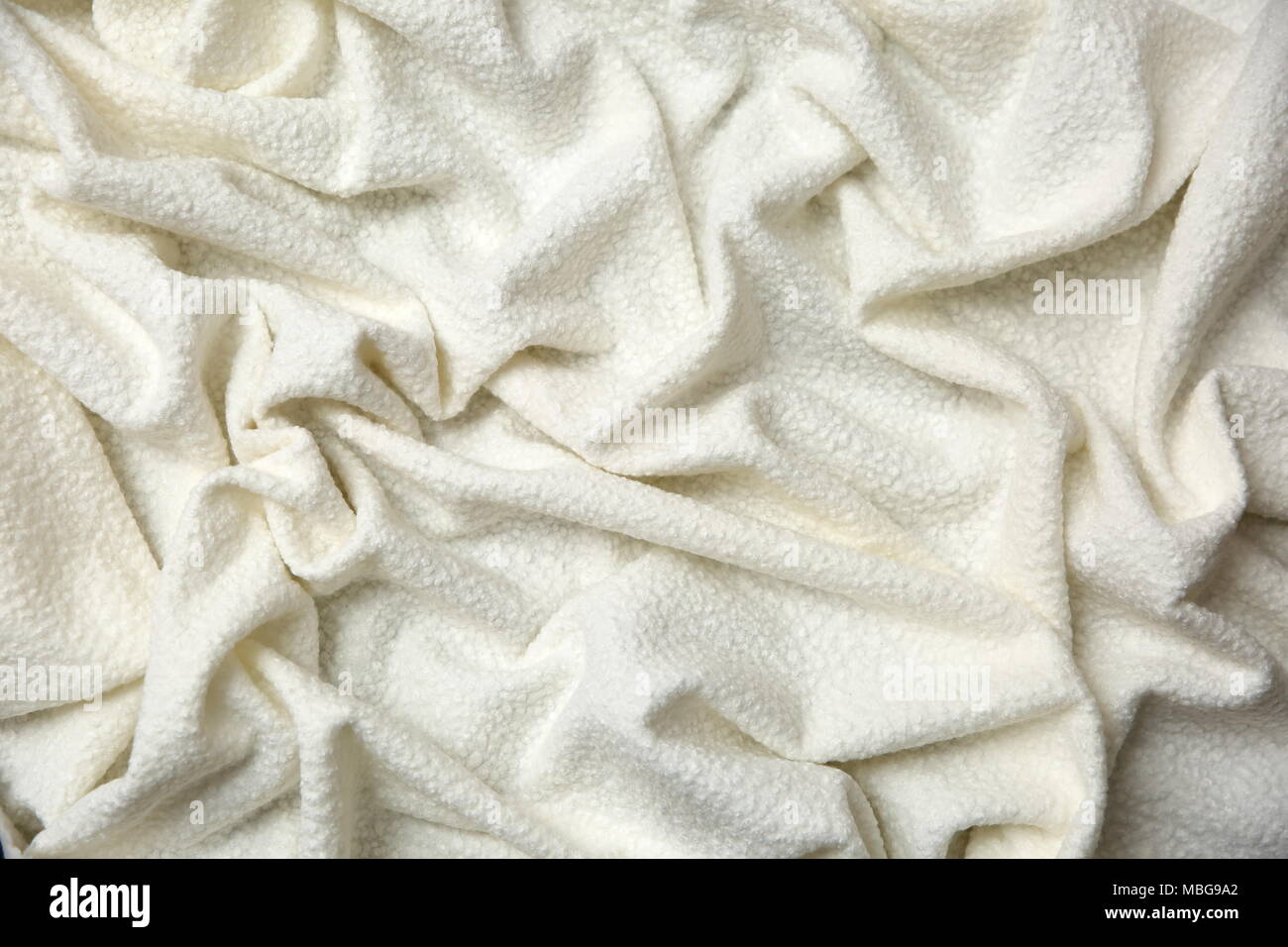 Cotton blanket with an interesting texture and crumpled irregularly in ...