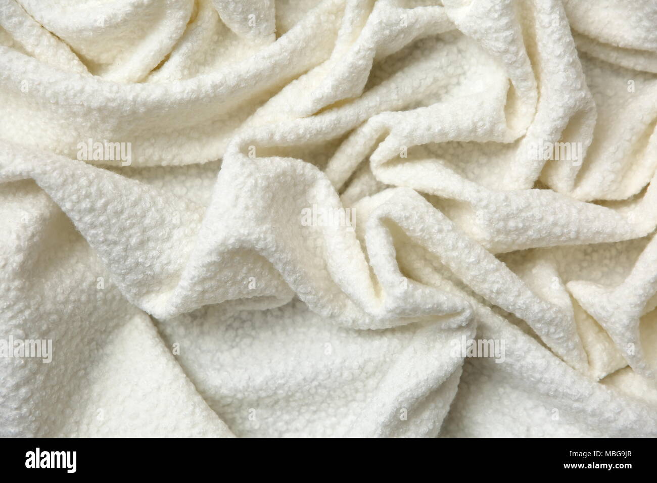 Cotton blanket with an interesting texture and crumpled irregularly in ...