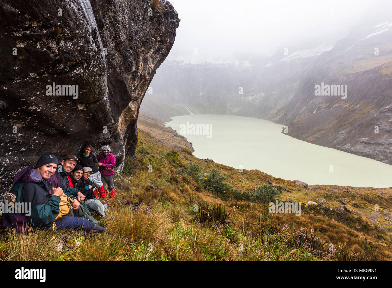 EL ALTAR, ECUADOR - MARCH 08: Group of hikers walking around the crater ...