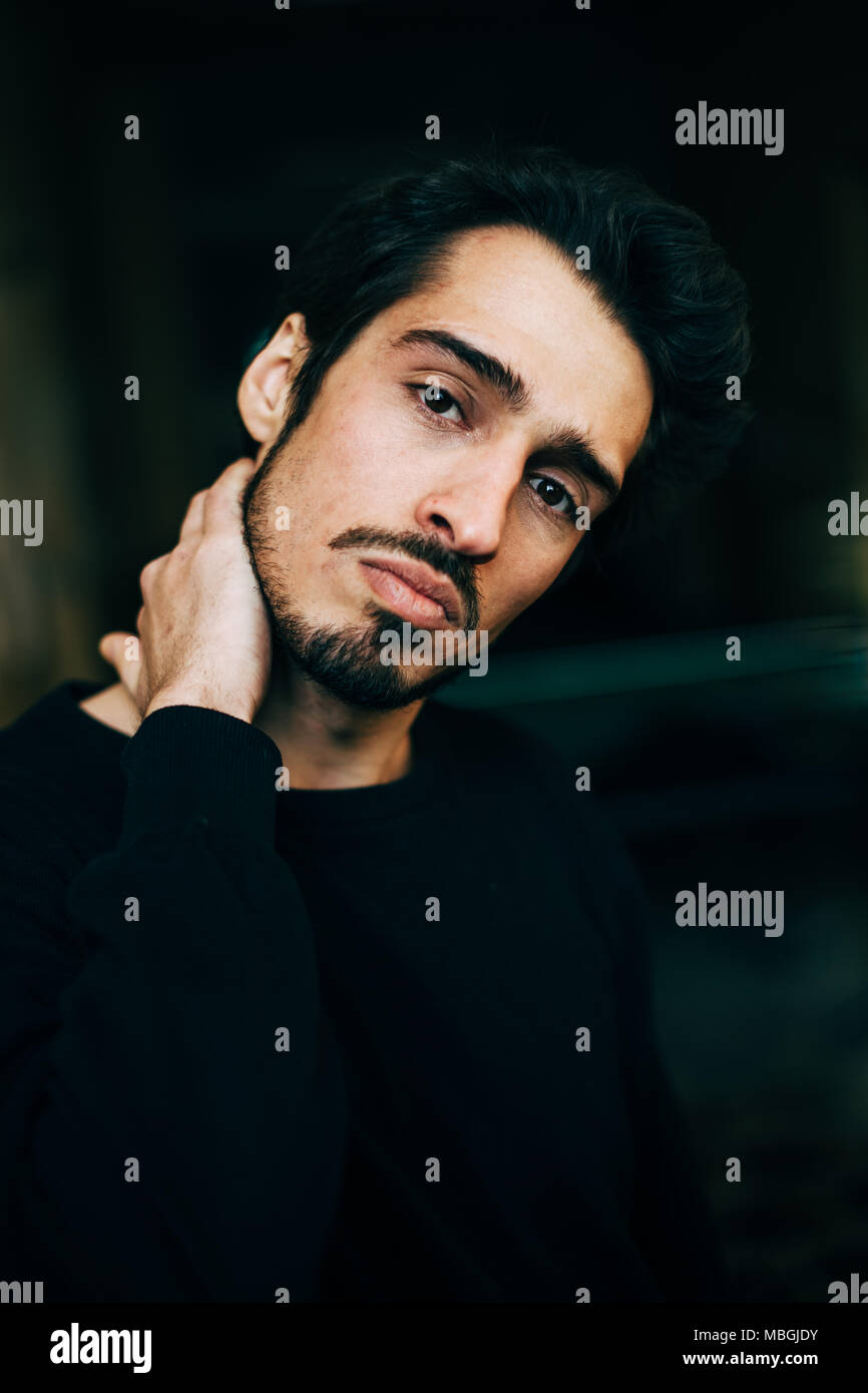 Sad and depressed Mediterranean man with beard and dark hair Stock ...