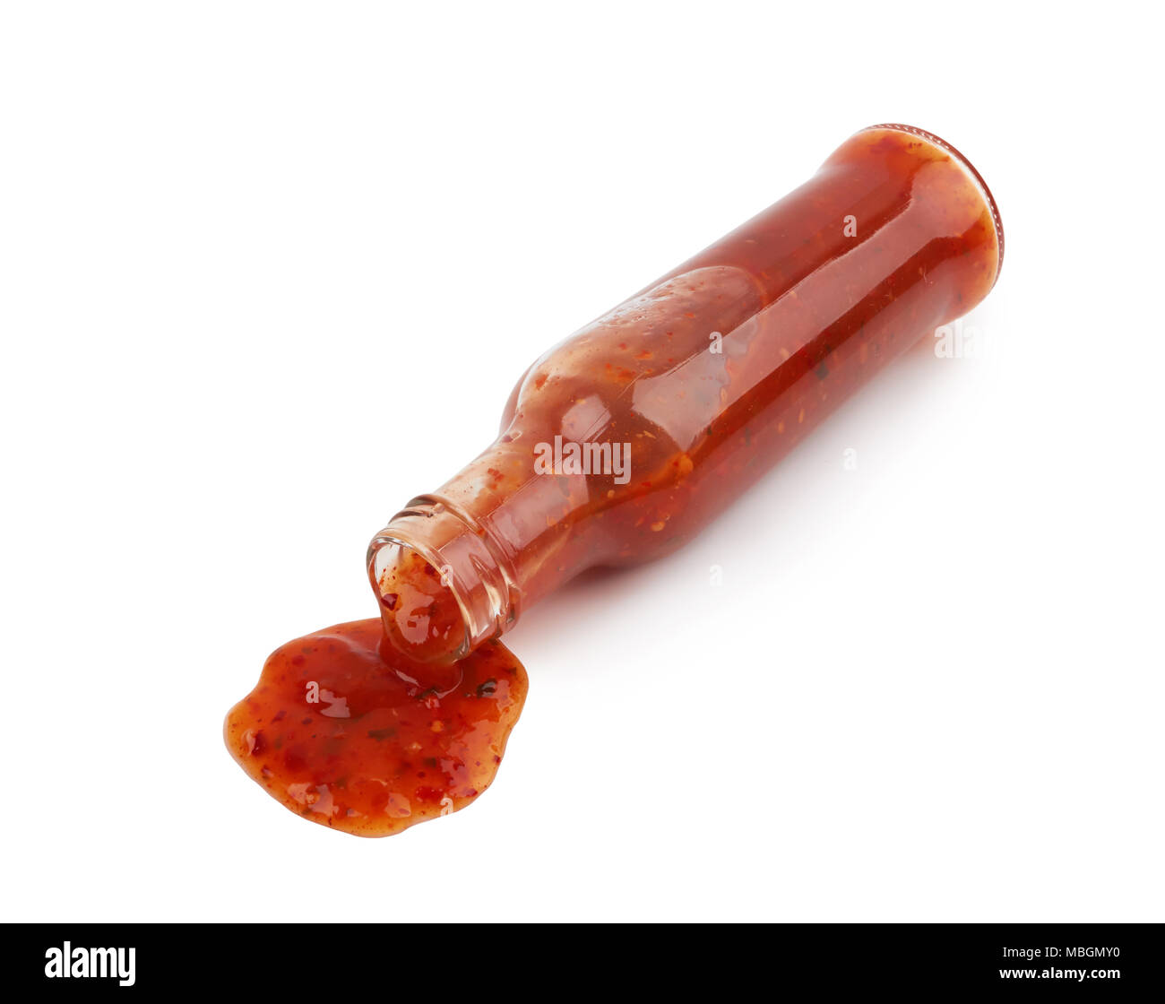 bottle of hot sauce is spilling liquid on white background Stock Photo ...