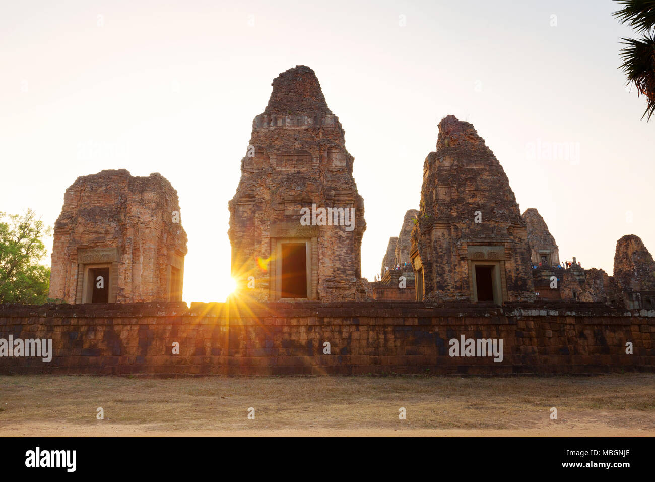 Sun setting behind temple hi-res stock photography and images - Alamy