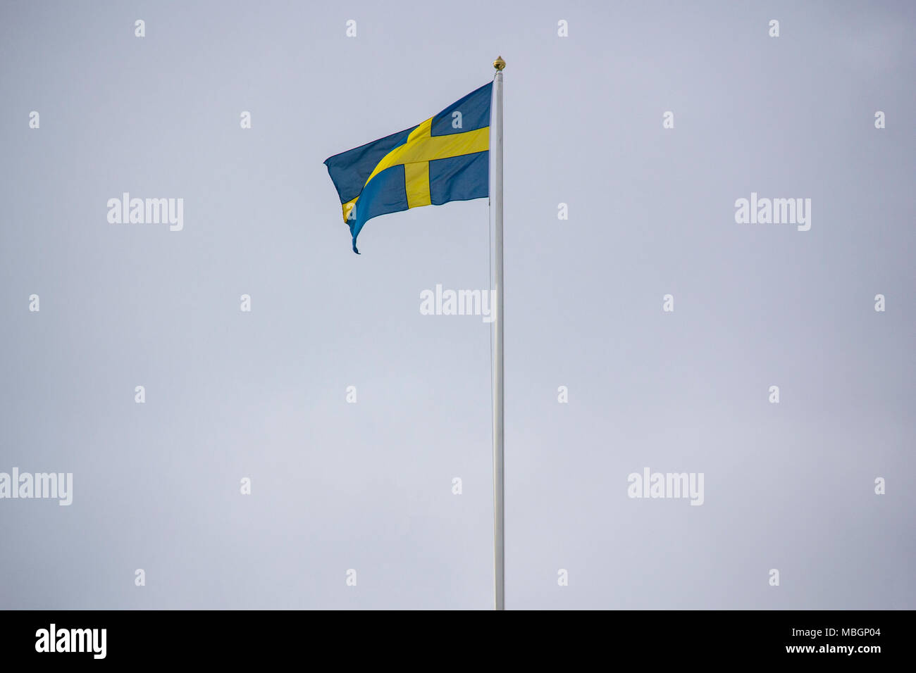 Swedish Flag Waving in the Wind. Skandinavian Sweden Flag on Grey Sky ...