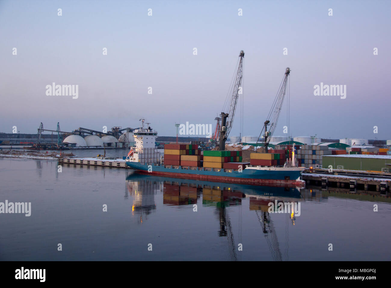 Freight shipping containers and gas oil tanks at the docks. in import ...