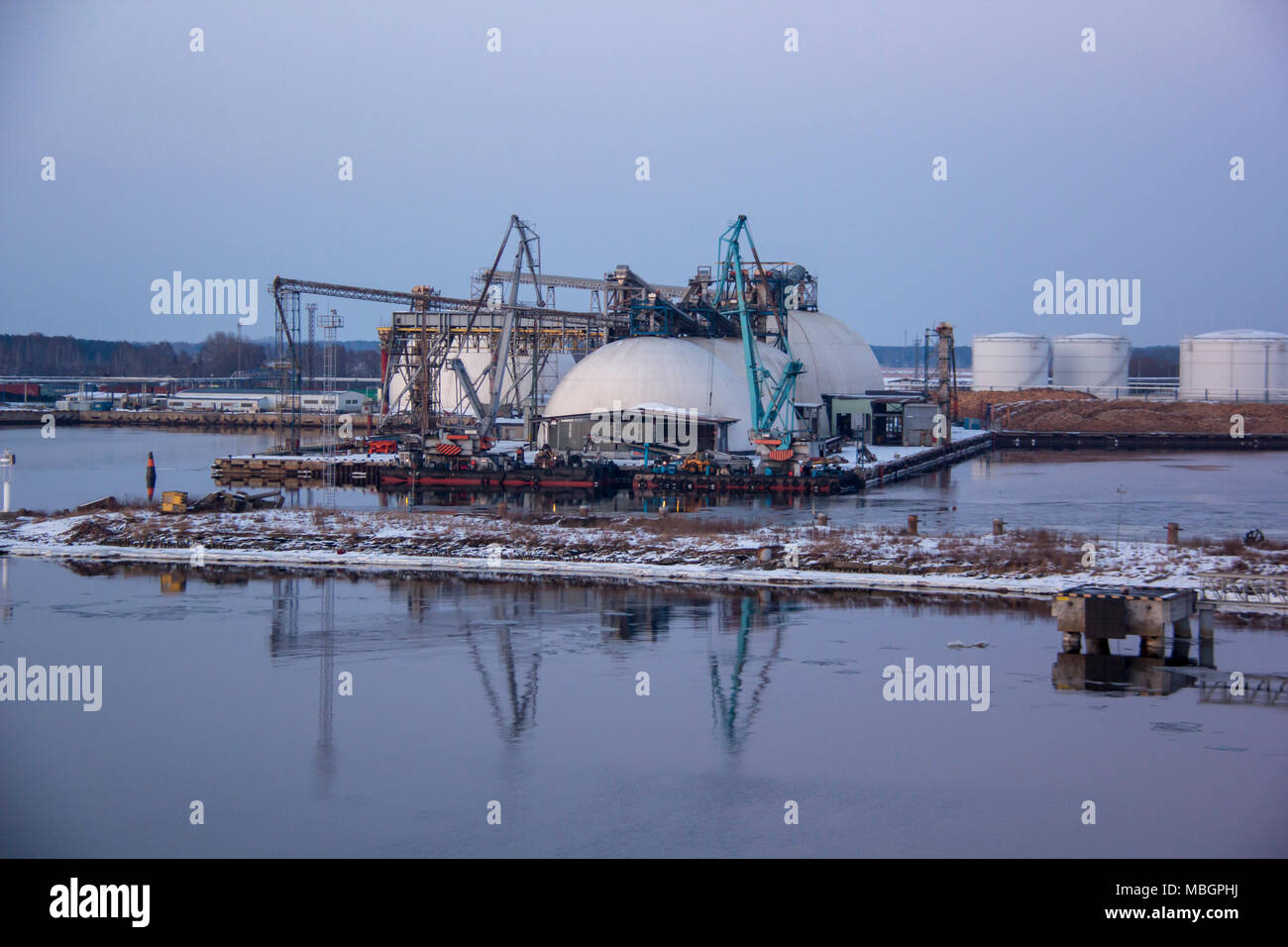 Freight shipping containers and gas oil tanks at the docks. in import ...
