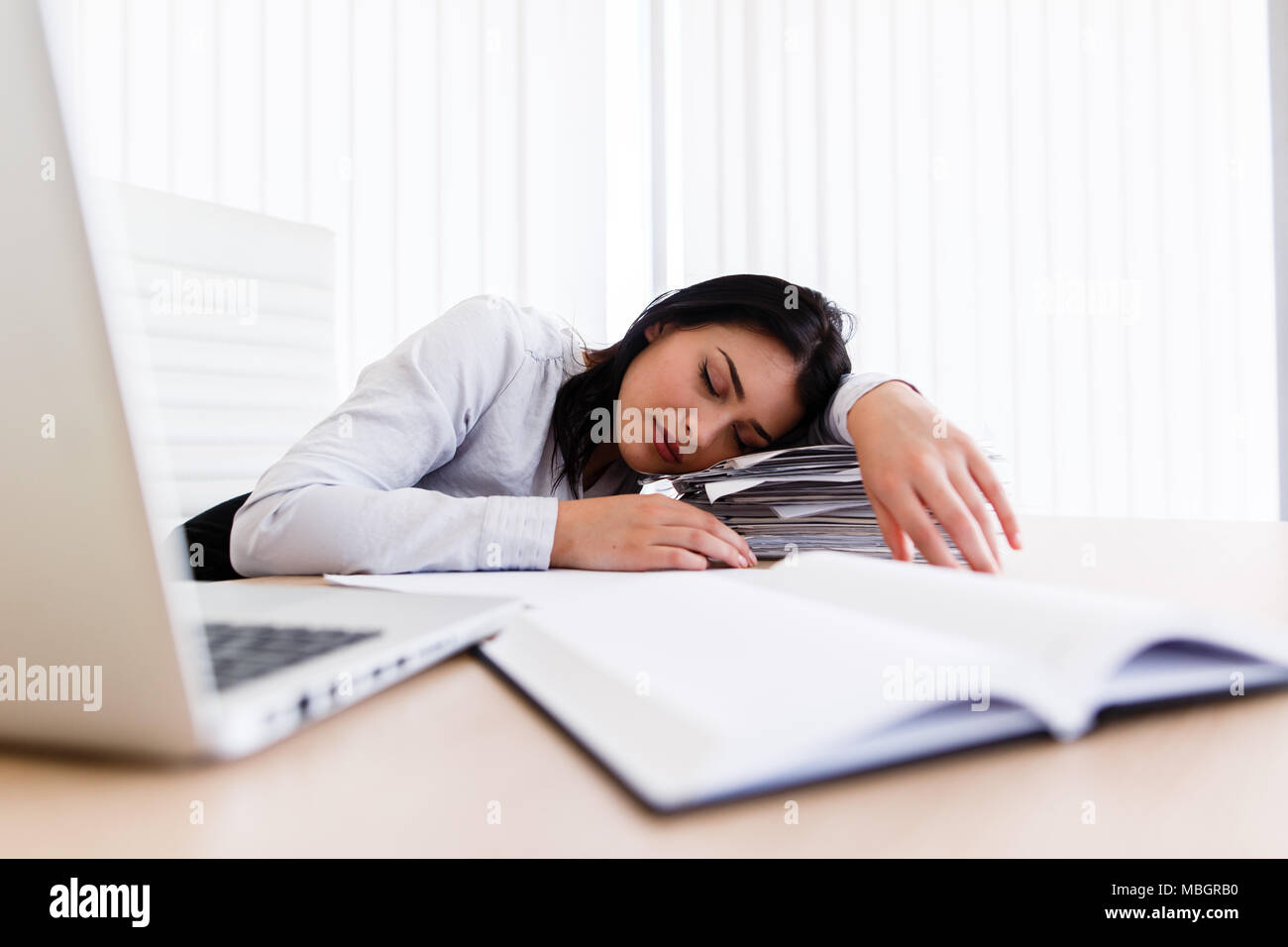 Woman Sleeping At Work