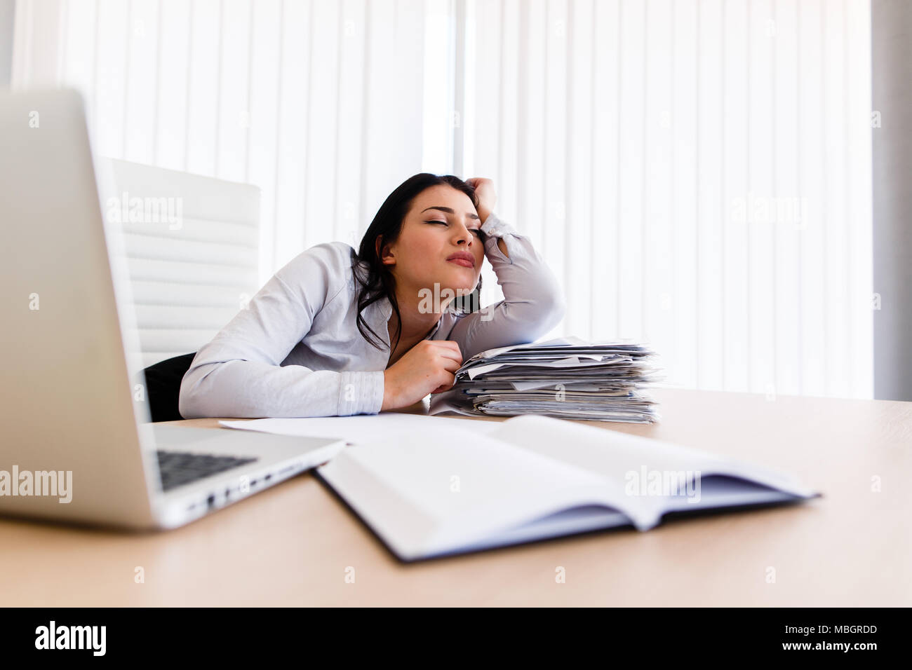 Woman Sleeping At Work