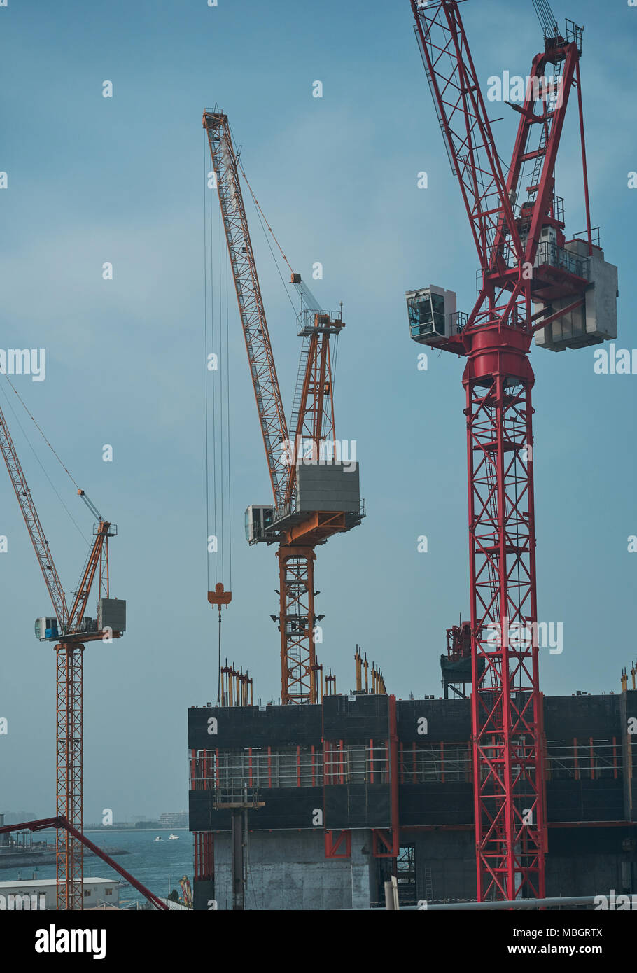 tower cranes on construction background Stock Photo - Alamy