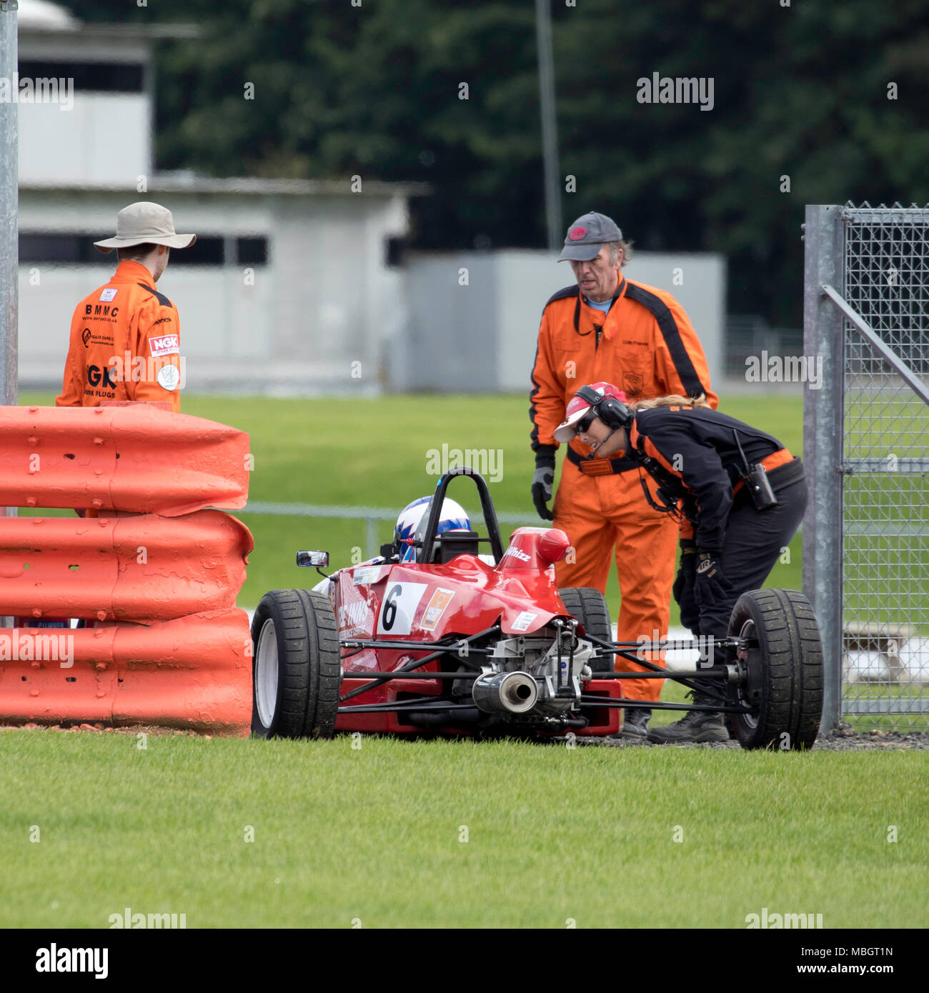 Track marshals in action at Silverstone with a single seater Stock ...