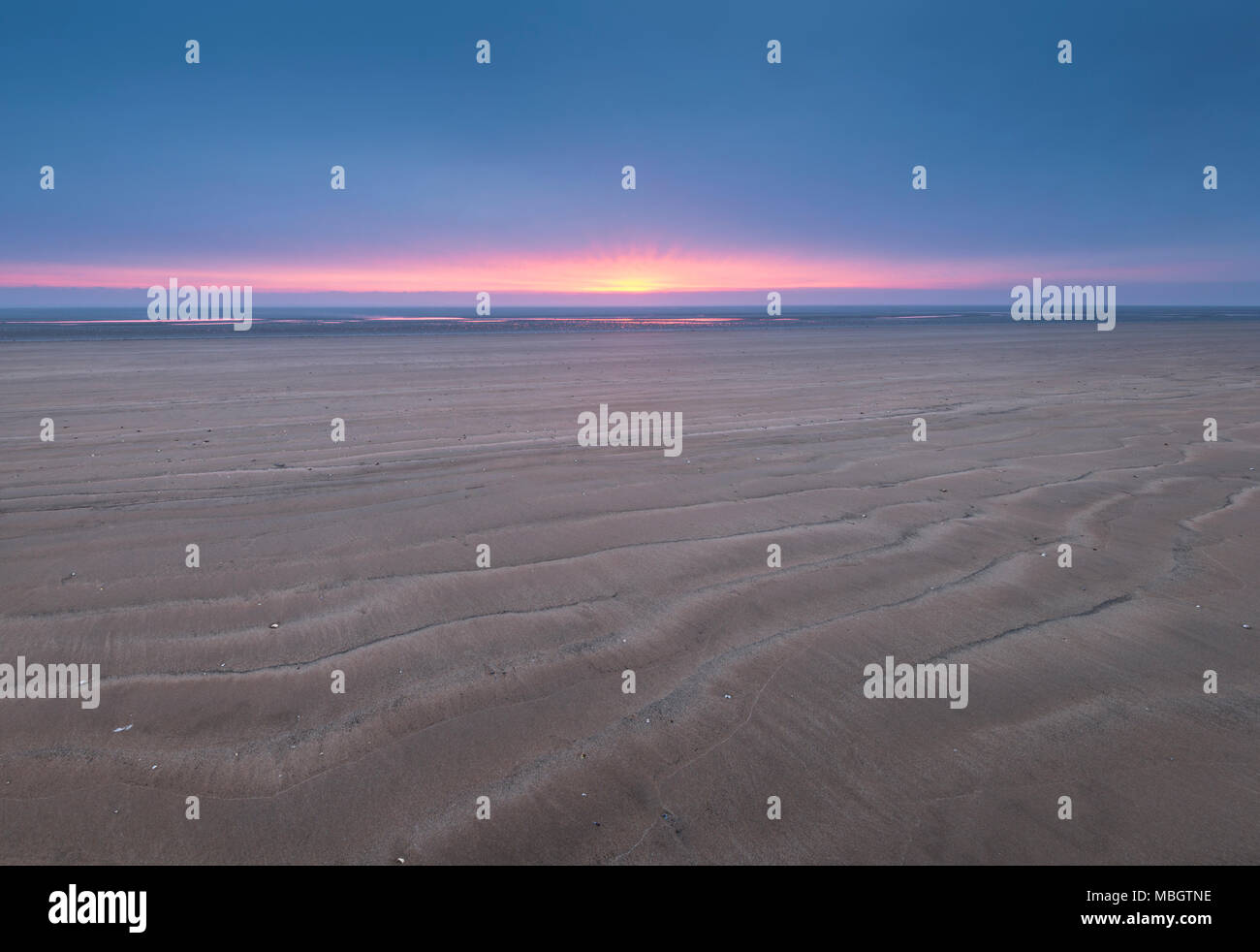 Ripples in the sand at Greatstone beach on the Kent coast at sunrise ...