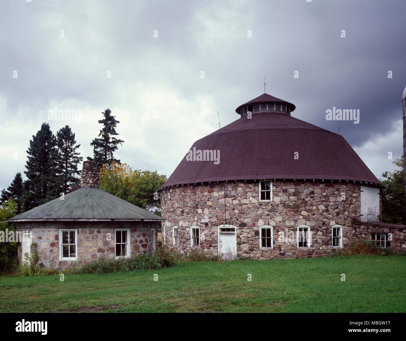 Round Stone Barn and round shed Stock Photo - Alamy