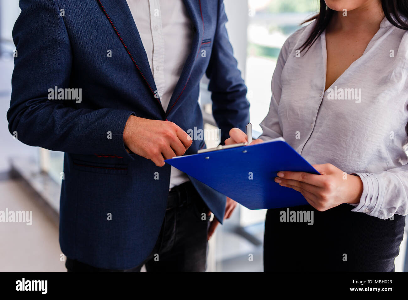 Business couple talking about some paperwork at their office Stock ...