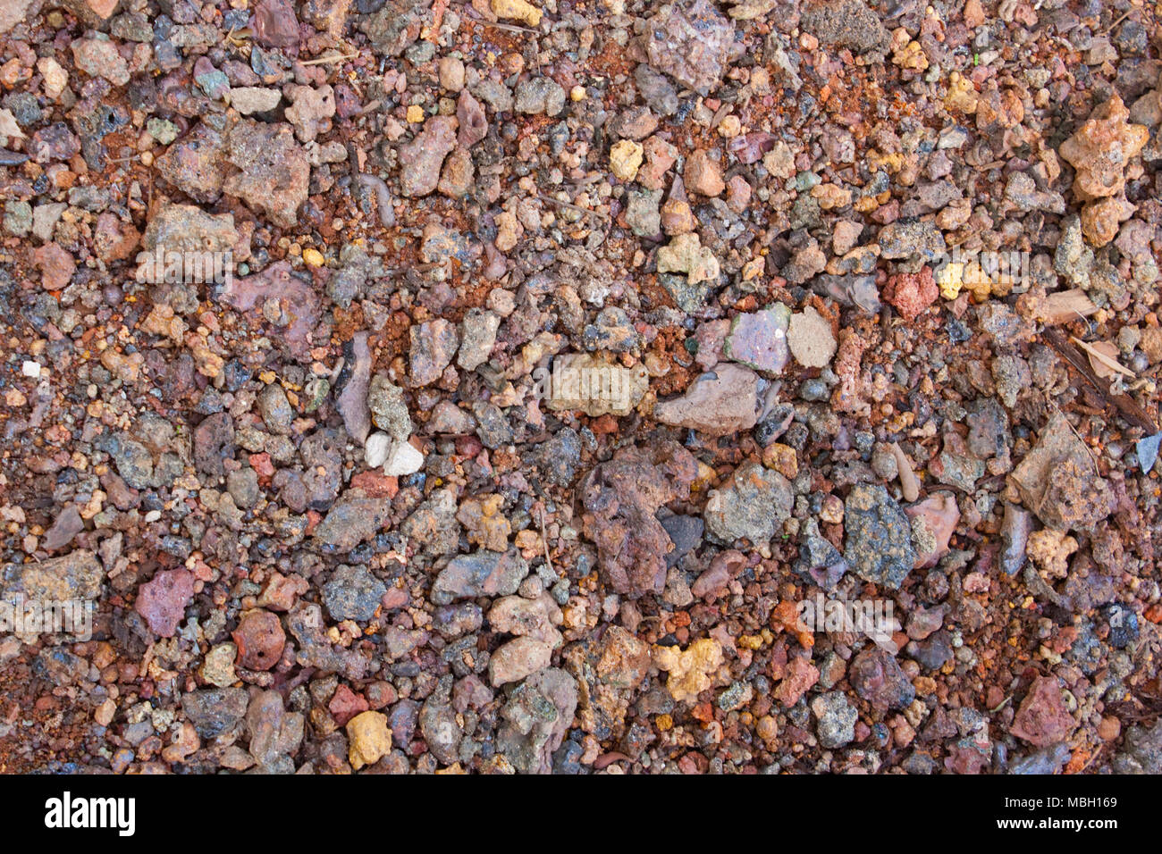 Rubble and slag scattered on an earth surface Stock Photo - Alamy