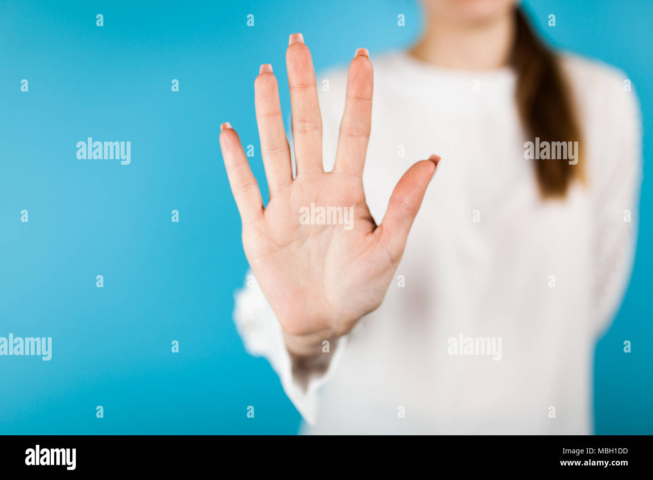 Woman showing stop sign with her hand Stock Photo - Alamy