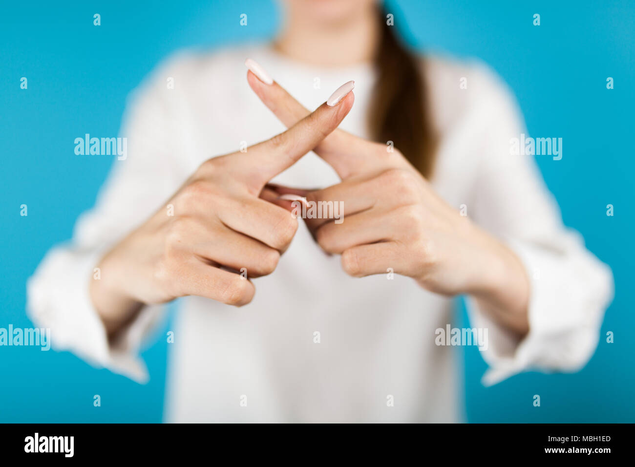 Woman showing stop sign with her hand Stock Photo - Alamy