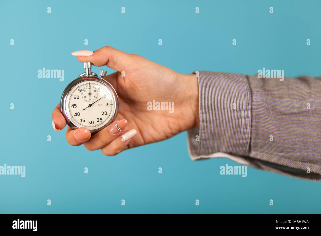 Hand holding stopwatch hi-res stock photography and images - Alamy