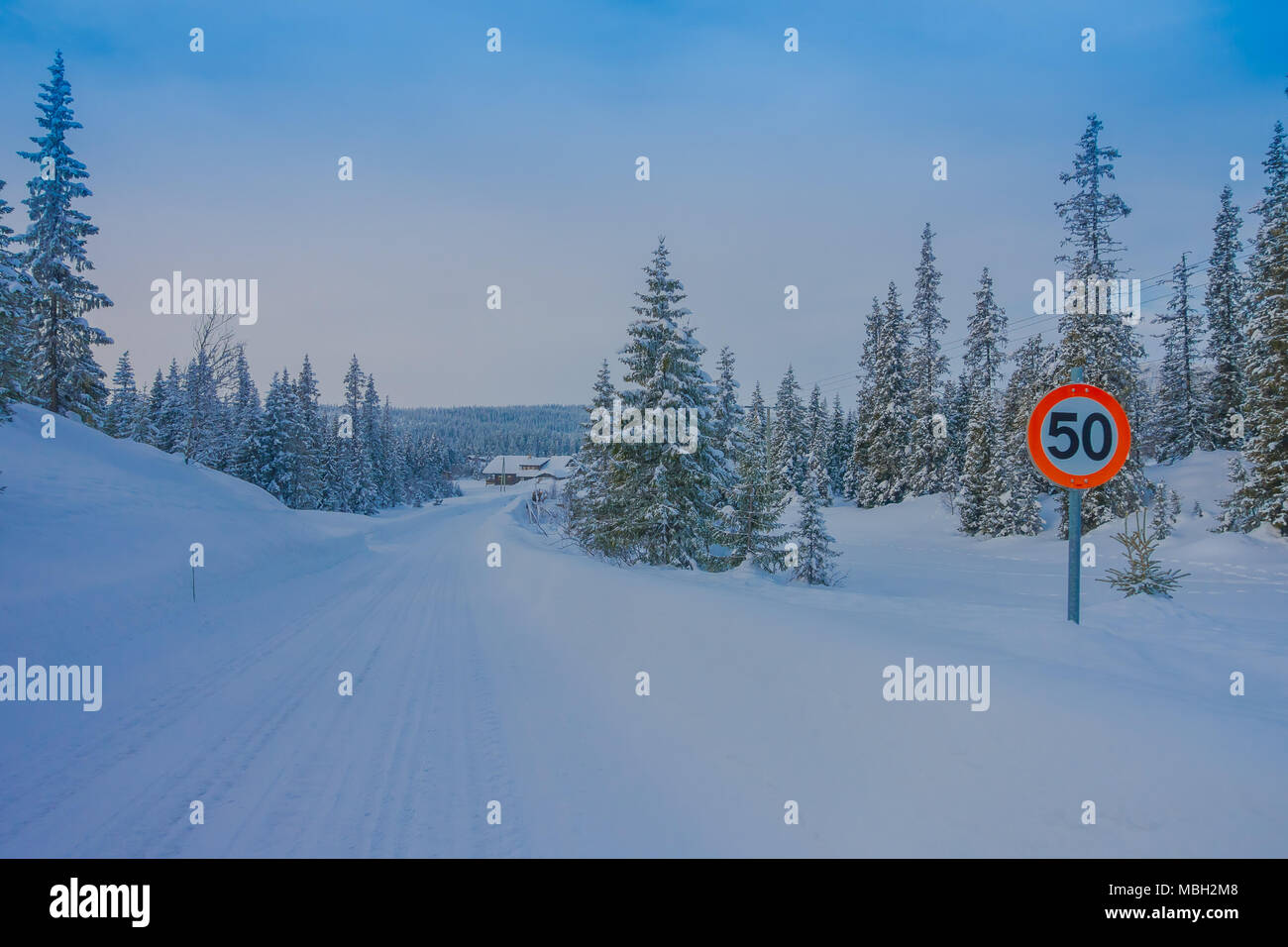 Snowy side road and speed limit hi-res stock photography and images - Alamy