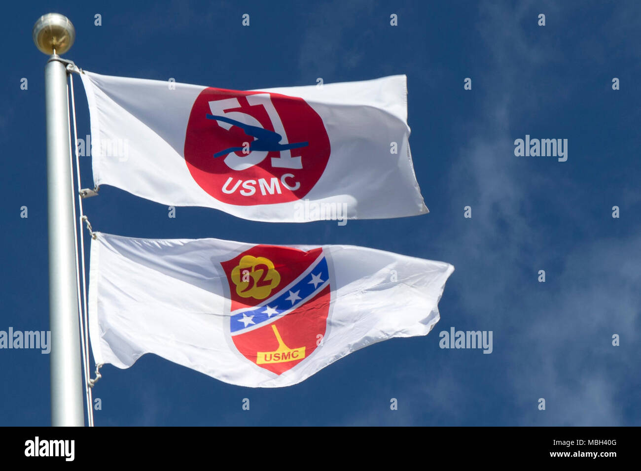 U.S. Marine Corps Flags of the 51st and 52nd Defense Battalions fly at ...
