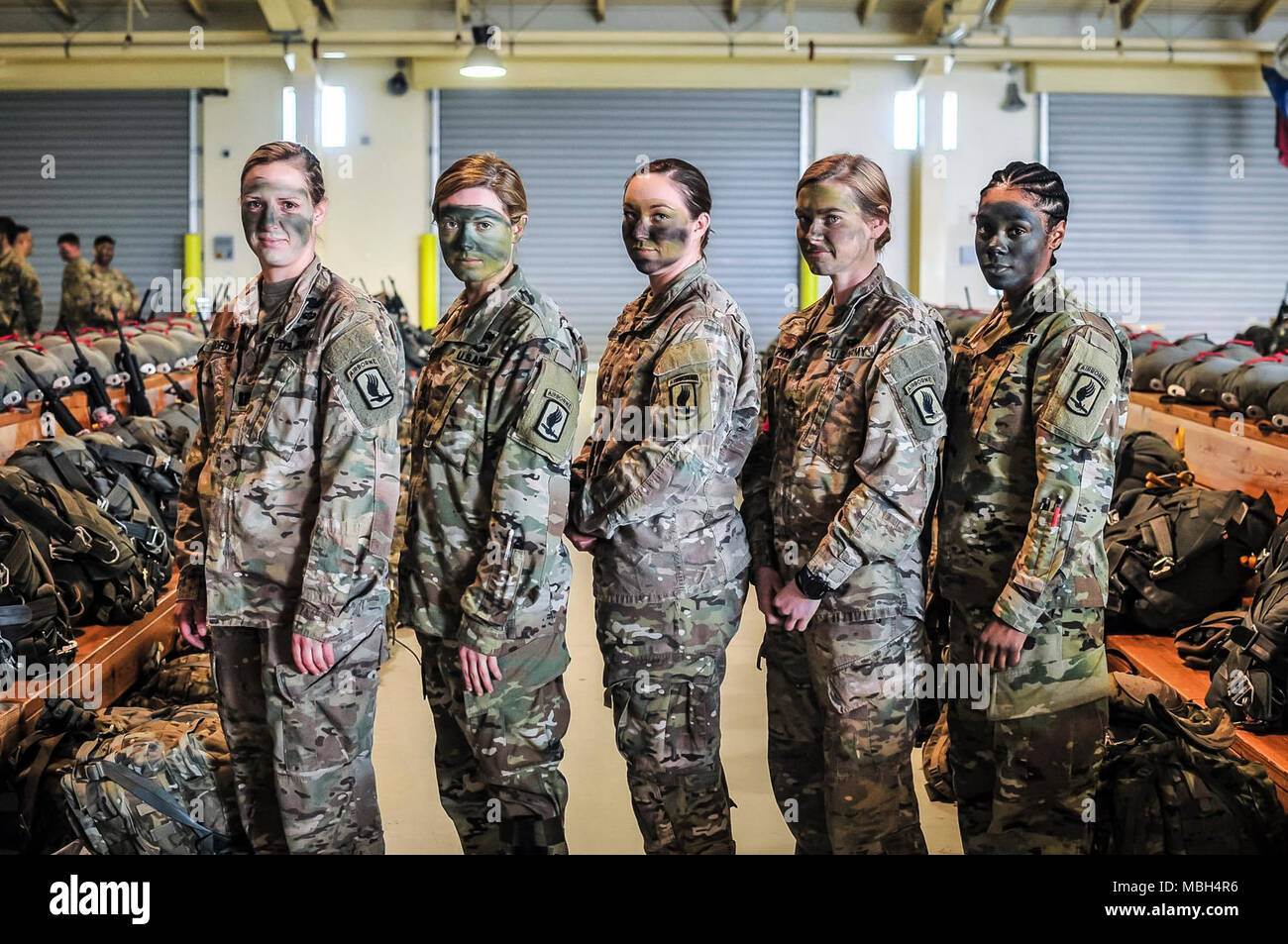 An all-female jumpmaster team prepares to deploy a number of ...