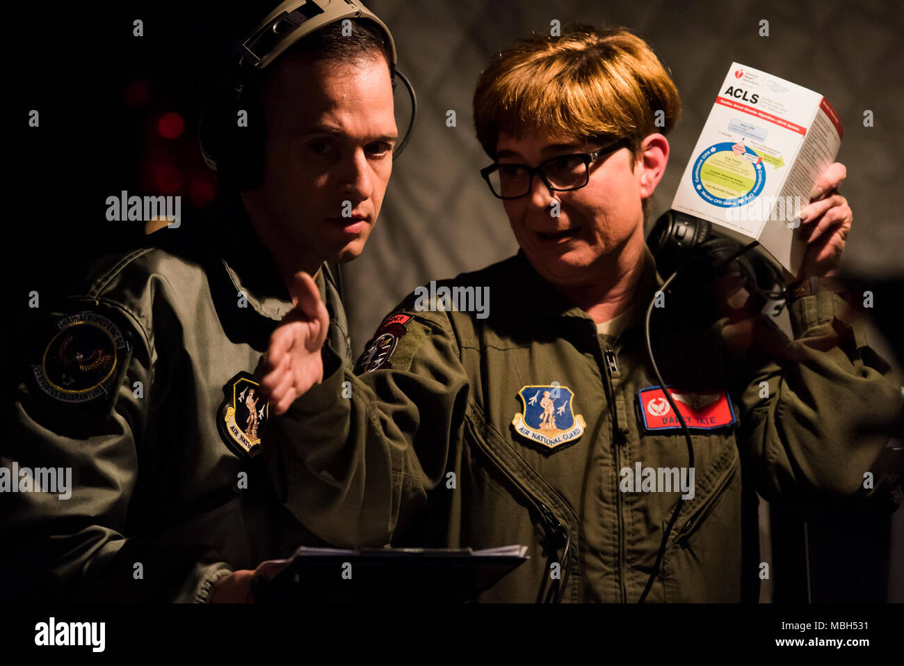 (From left) Senior Master Sgt. Eric Emmett, an aeromedical evacuation ...