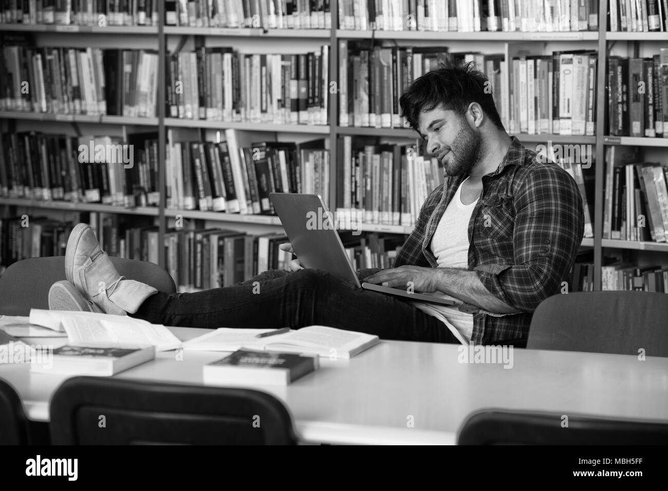 Man in classroom studying Black and White Stock Photos & Images - Alamy