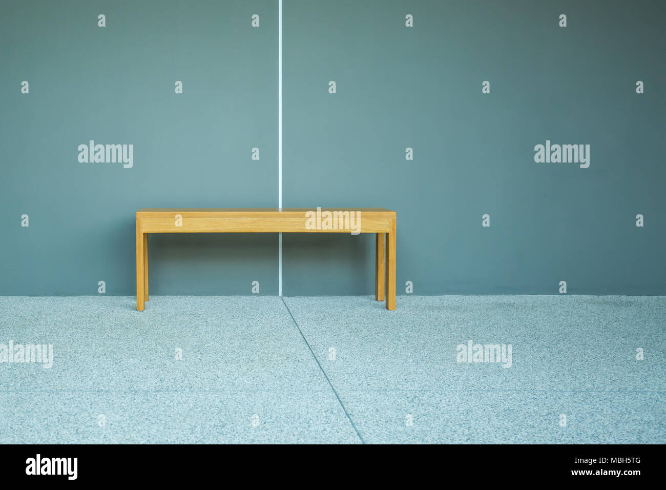 Wooden bench on the wall Stock Photo - Alamy