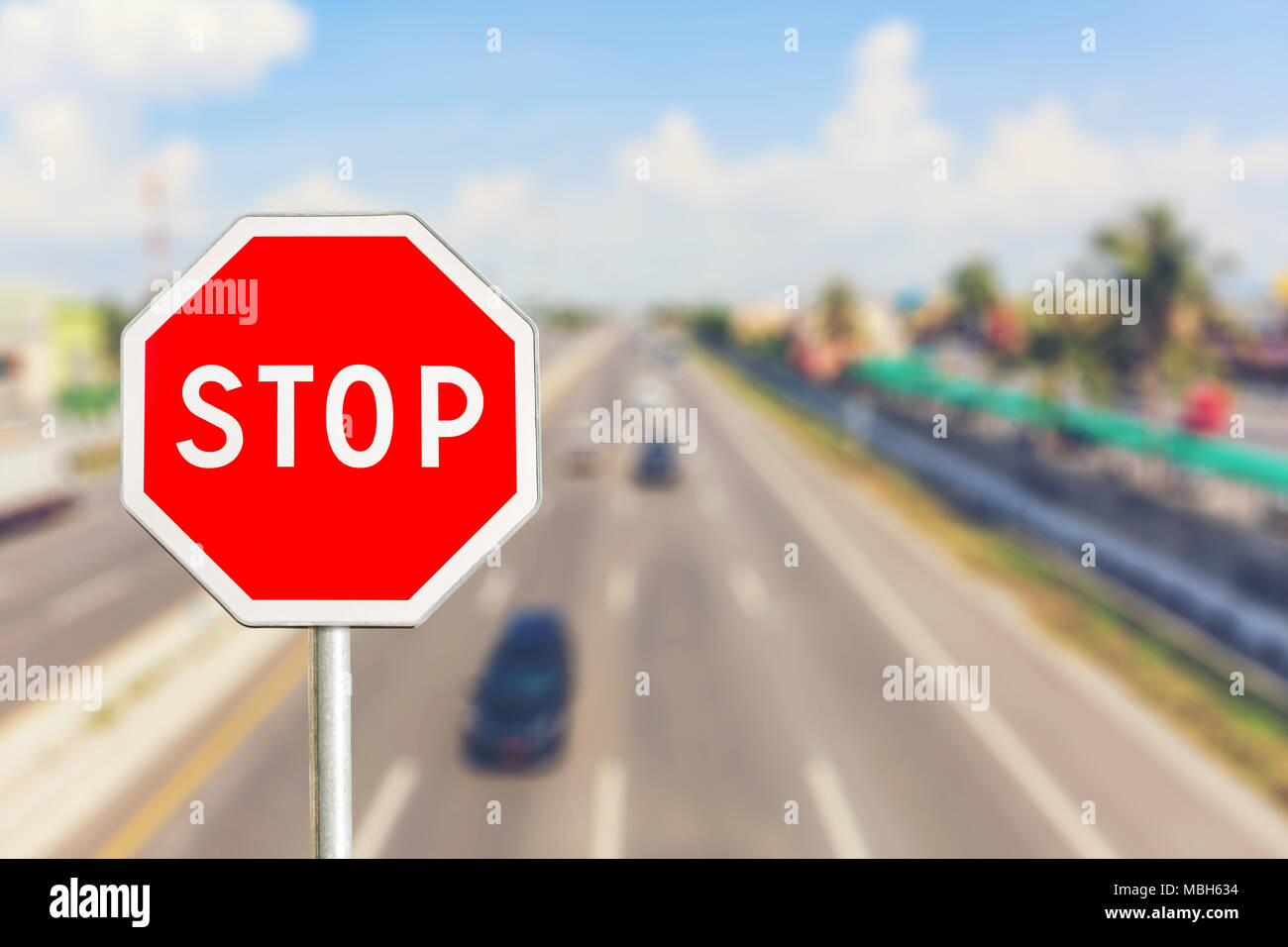 Stop sign by the Highway road Stock Photo - Alamy