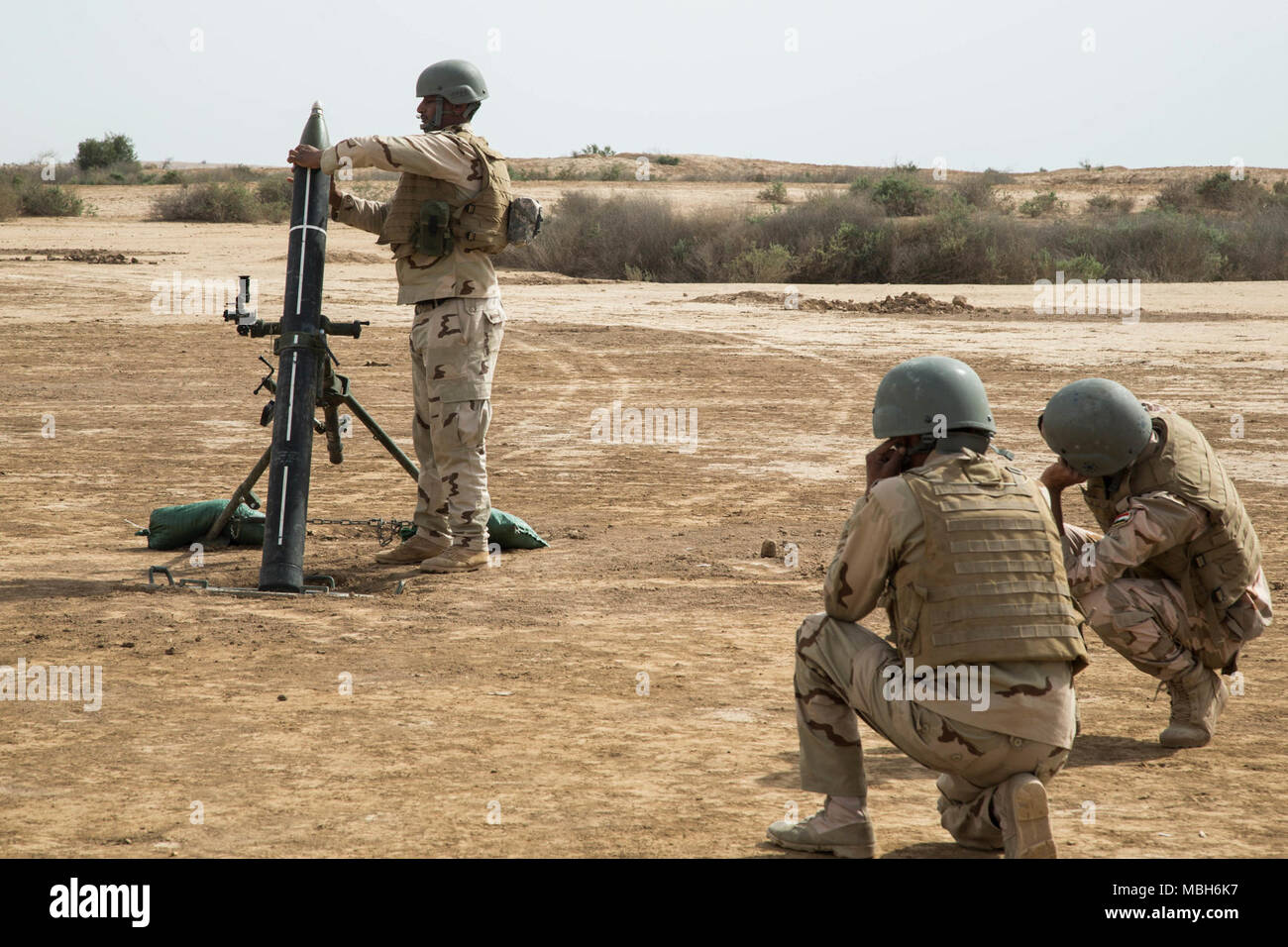 Iraqi soldiers from the 40th Brigade, prepare to fire a 120 mm mortar ...