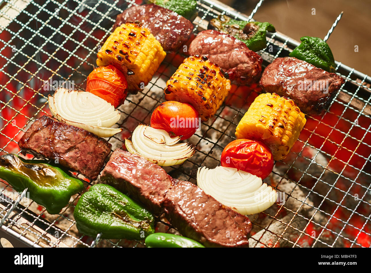 Meat skewers on grill Stock Photo - Alamy