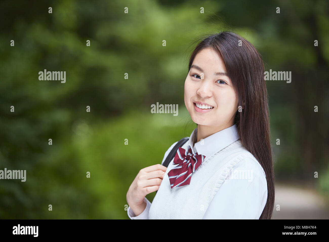 School uniform girl green hi-res stock photography and images - Alamy