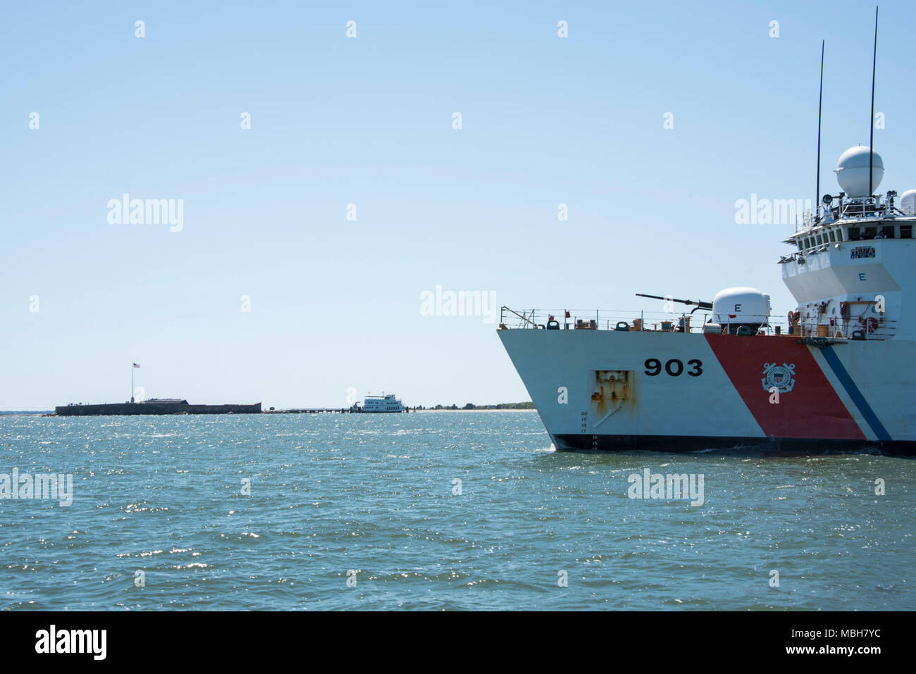 The crew of the Coast Guard Cutter Harriet Lane sails past Fort Sumter ...
