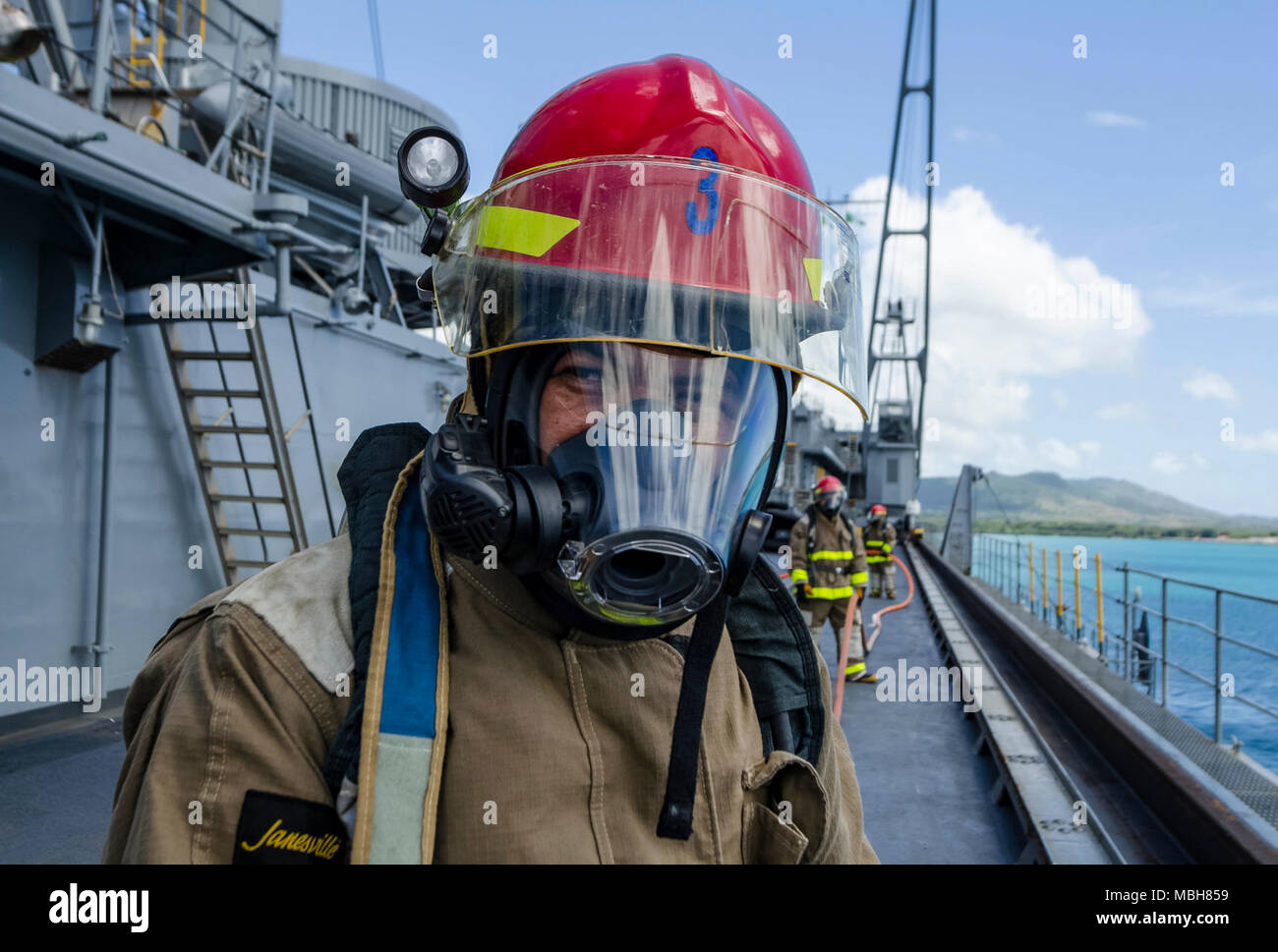 U.S. Navy Military Sealift Command civilian mariners, assigned to the ...