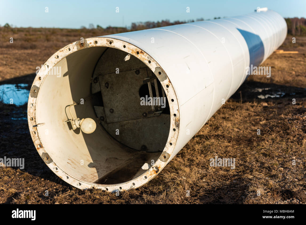 Decommissioned wind turbine tower lying on the ground awaiting ...