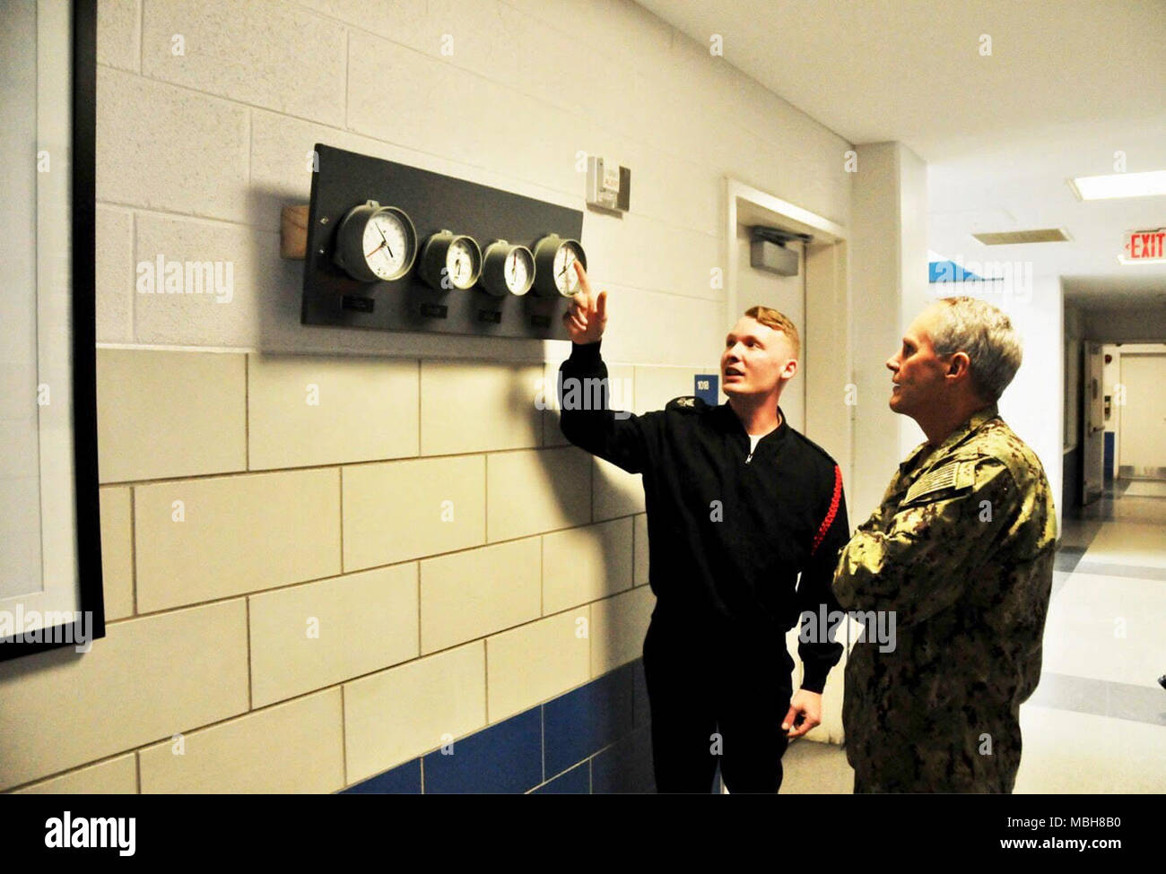 Commander, U.S. 7th Fleet Vice Adm. Phil Sawyer, receives a ...