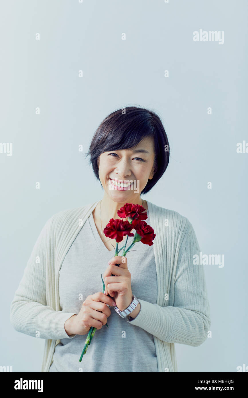 Woman receiving red roses hi-res stock photography and images - Alamy