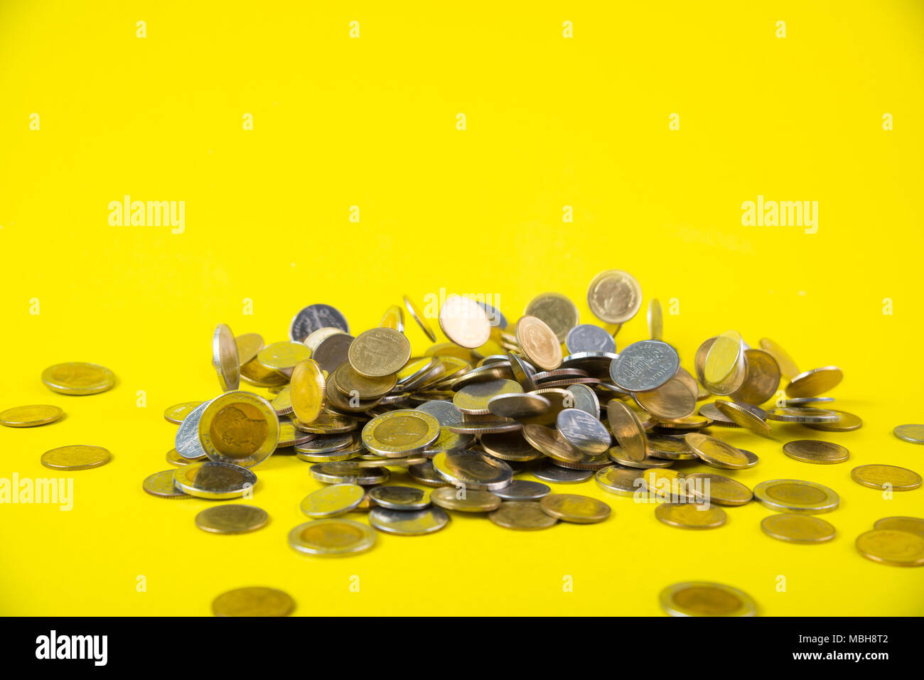 Falling coins money on yellow background, business wealth concept idea ...