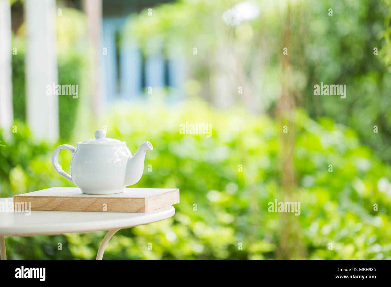 teapot on a blurred background of nature Stock Photo - Alamy