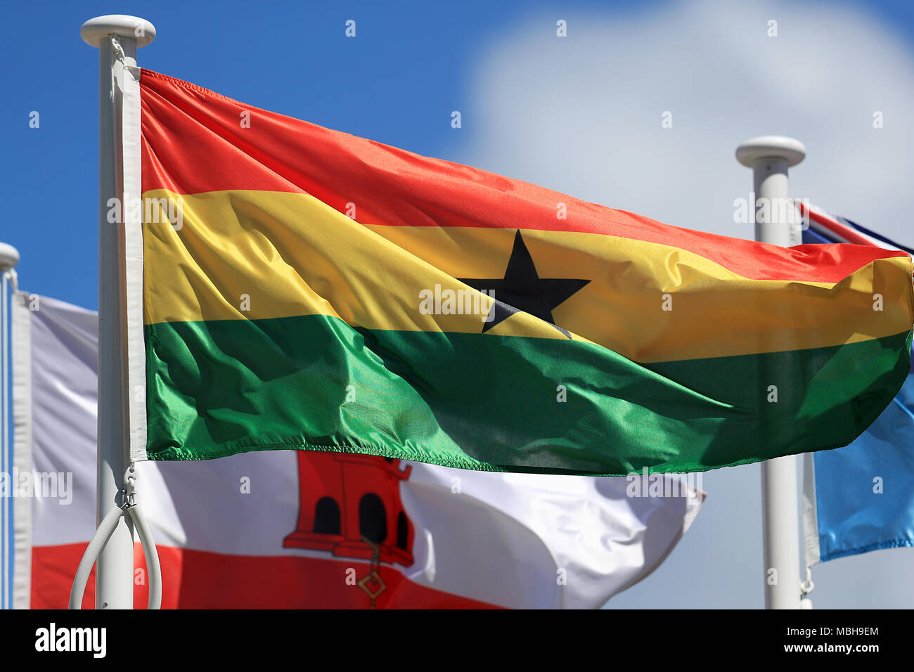 The flag of ghana on pole at the commonwealth games hi-res stock ...