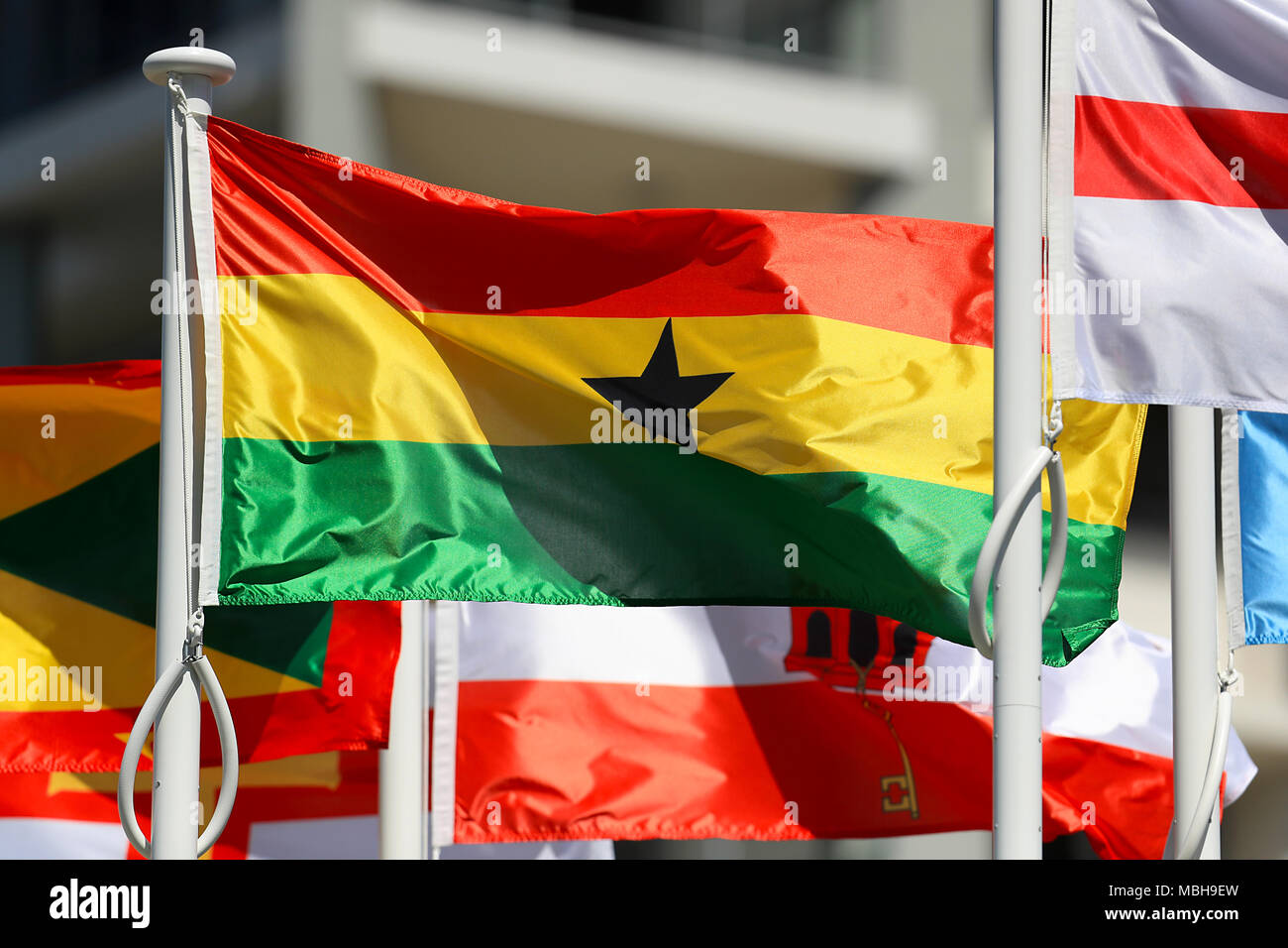 The flag of Ghana on a pole at the Commonwealth Games Stock Photo - Alamy