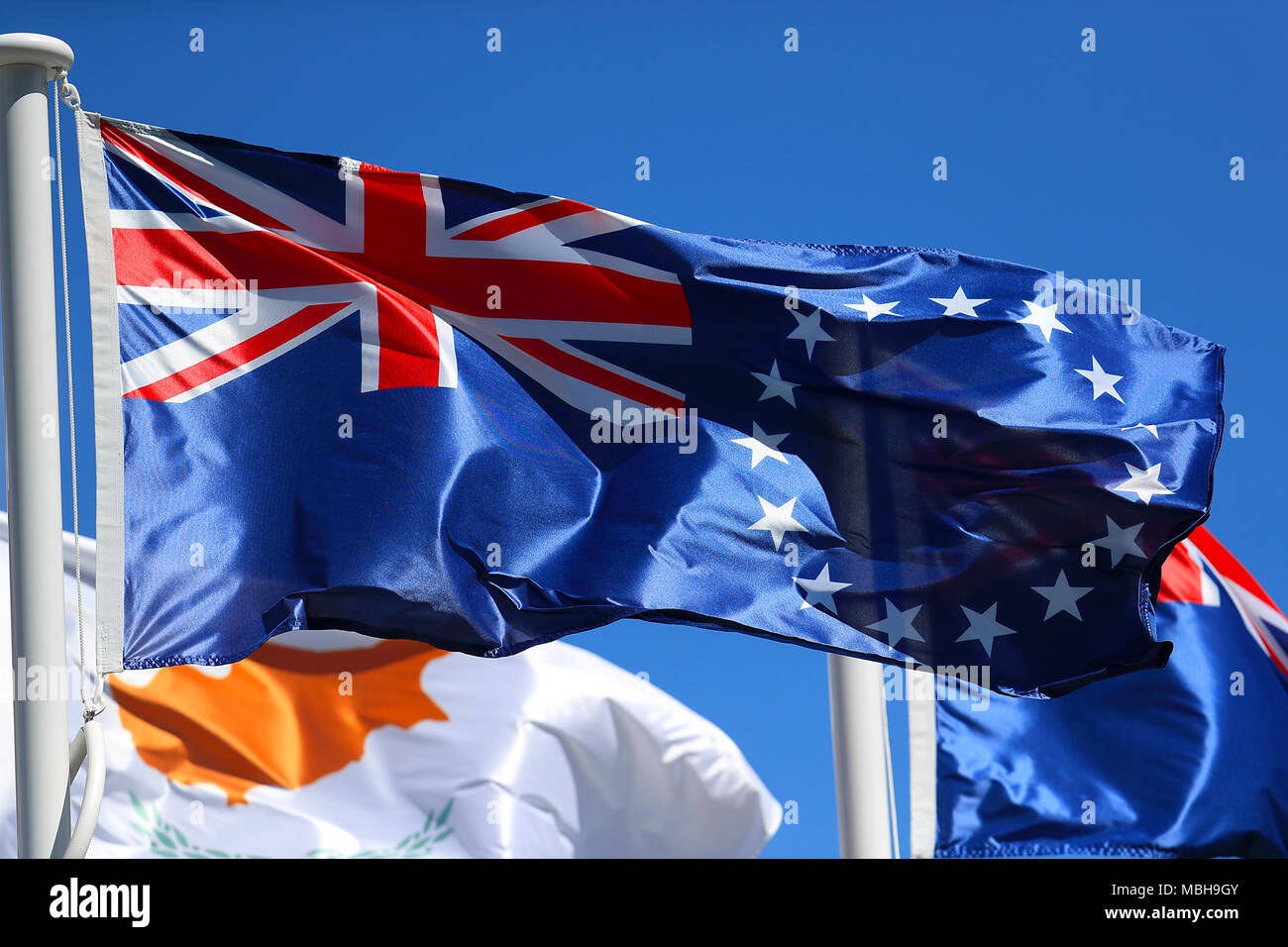 The flag of the Cook Islands on a pole at the Commonwealth Games Stock ...
