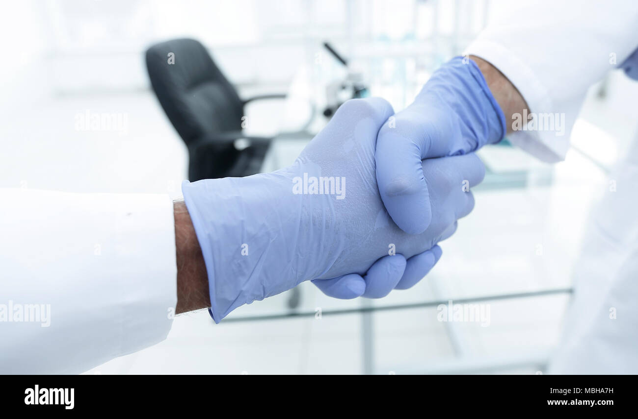 hand in the medical glove (handshake Stock Photo - Alamy