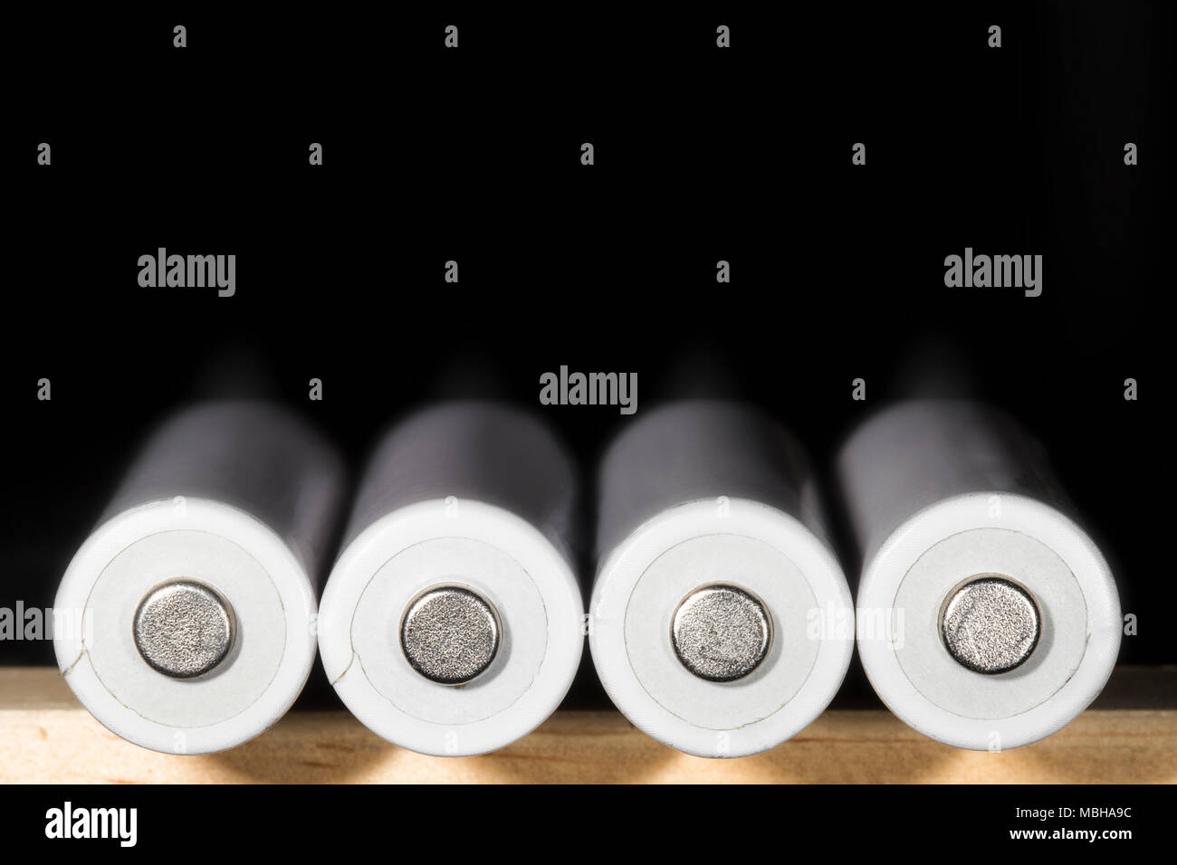 white batteries on the board, background image with space for text ...