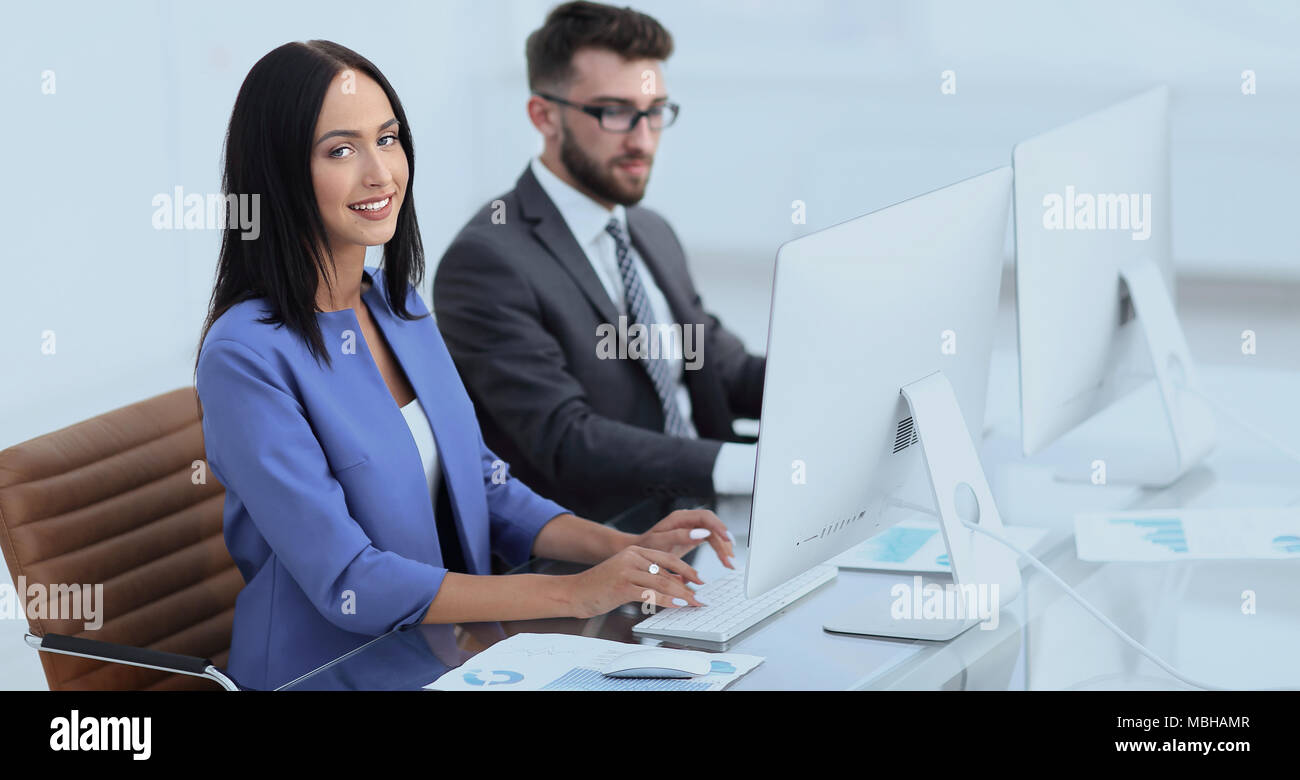 Business partners at work in front of desktop Stock Photo - Alamy