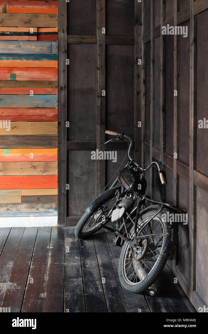Old motorcycle, which needs to be repaired, in the workshop Stock Photo ...